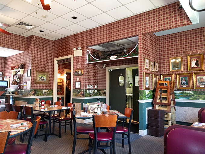 Step inside and the checkered wallpaper, wooden chairs, and train memorabilia transport you to a simpler time when restaurants had personality, not marketing plans.