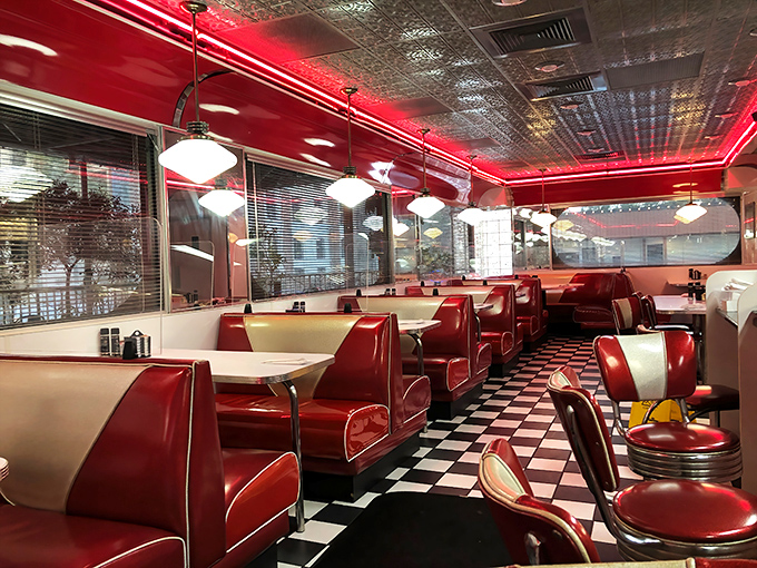 Red vinyl booths and checkered floors create the perfect backdrop for serious breakfast conversations.