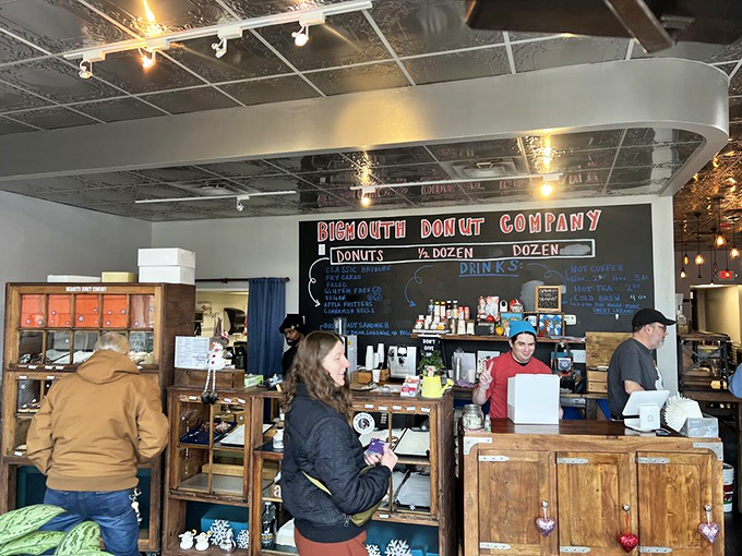 Inside, rustic wooden counters and a chalkboard menu create the perfect backdrop for donut magic. Like a well-directed food scene, everything here sets the stage for the star attraction.