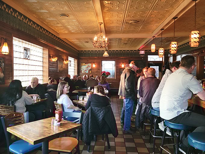 Inside, that gorgeous pressed tin ceiling and warm wood paneling create the kind of atmosphere money can't buy &ndash; only decades of good times can.