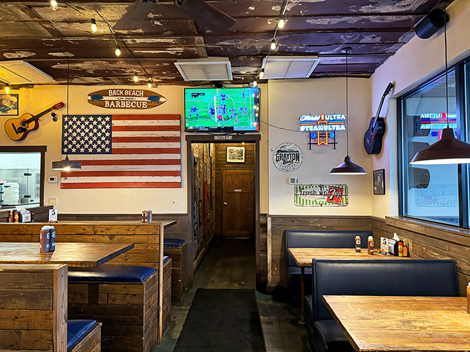 Inside, American flags and wooden booths create that perfect "come as you are" vibe where napkins aren't just suggested&mdash;they're mandatory equipment.