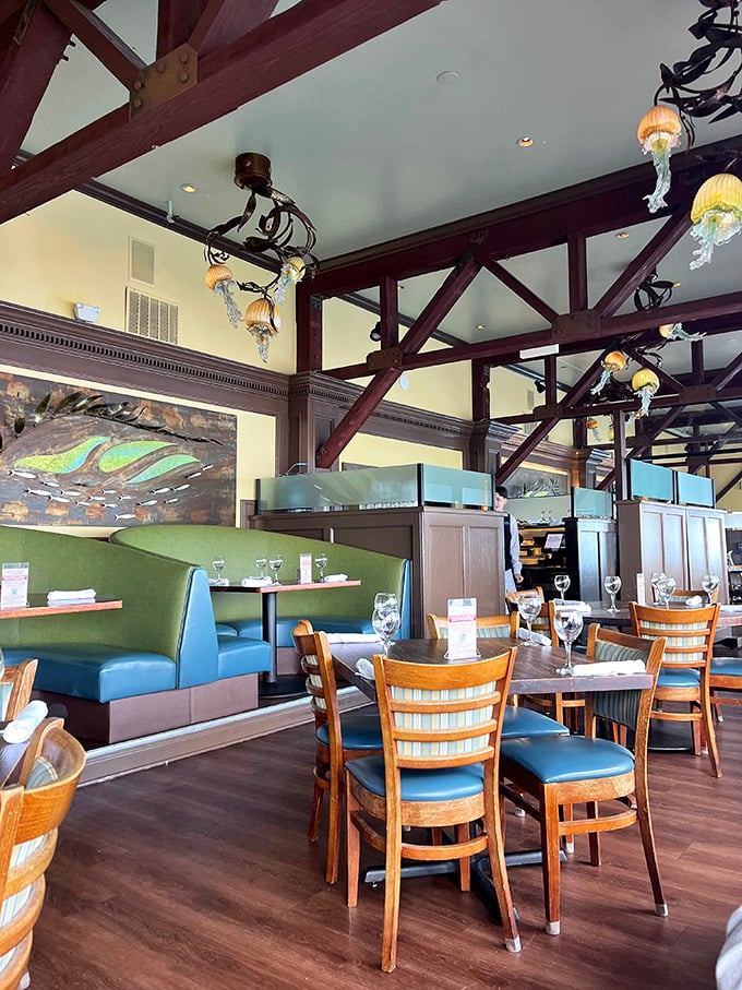 Exposed wooden beams and jellyfish-inspired lighting create an atmosphere that says "upscale nautical" without a single fishing net in sight.