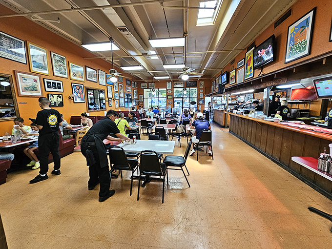 Orange walls adorned with decades of collected art create the perfect backdrop for Miami's morning ritual. No designer needed&mdash;just good taste in more ways than one.