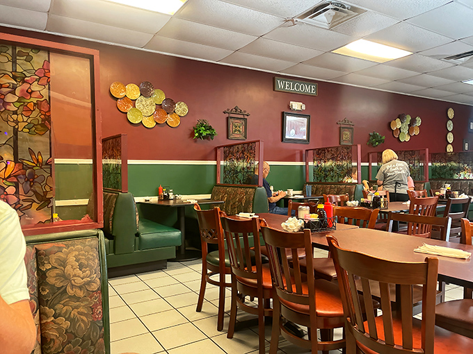 Those burgundy walls and green booths create the kind of cozy that makes you want to move in permanently.