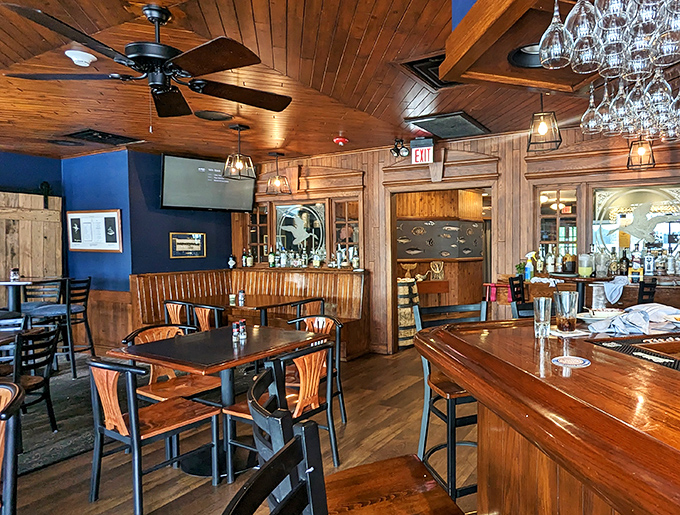 Warm wooden ceilings, navy blue walls, and nautical touches create the perfect maritime backdrop for seafood feasting. No plastic lobsters in sight&mdash;just honest Eastern Shore charm.