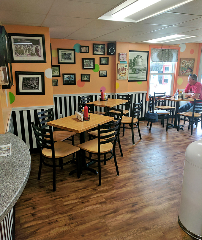 Cheerful orange walls, black and white striped wainscoting, and decades of memories create the perfect backdrop for post-burger ice cream indulgence.