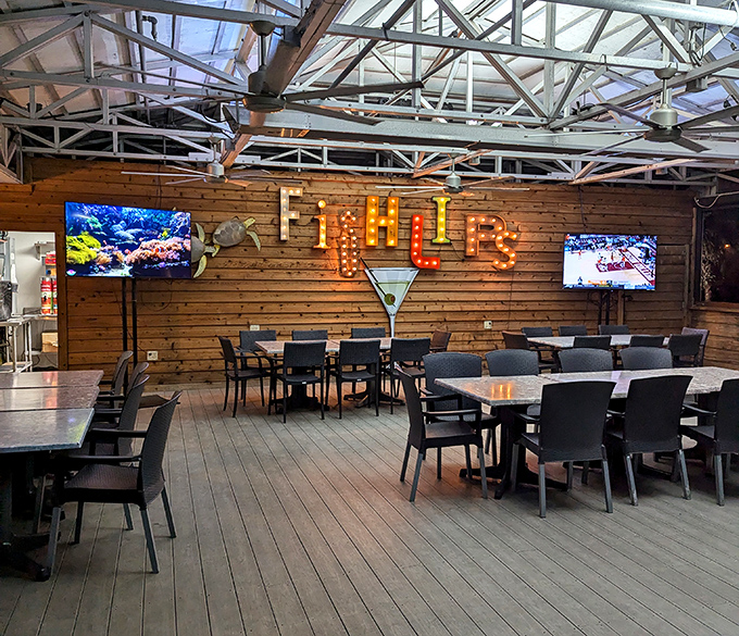 That illuminated sign isn't just decor &ndash; it's a beacon calling hungry souls to waterfront dining nirvana.