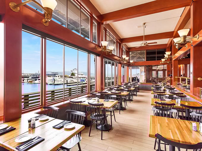 Warm wood tones and panoramic bay views create the perfect backdrop for seafood feasts that rival the scenery.