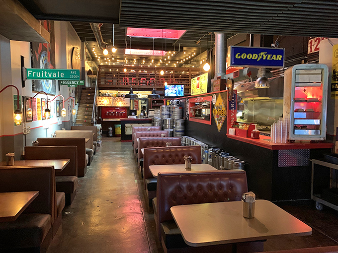 Vintage street signs, warm string lights, and leather booths create that perfect "I've discovered something special" atmosphere.