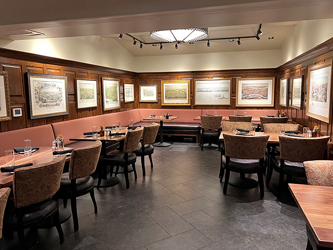 Wood paneling meets pink upholstery in this dining room where history hangs on the walls and memories are made at every table.