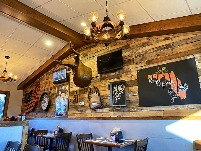 Rustic wooden walls adorned with Americana create the perfect backdrop for BBQ feasting. That longhorn isn't just decoration&mdash;it's keeping an eye on your leftovers.
