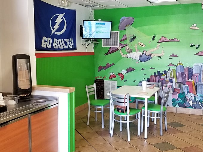 Local pride meets sandwich artistry inside Mickey's, where Tampa Bay Lightning banners and whimsical murals create the perfect backdrop for serious sub consumption.