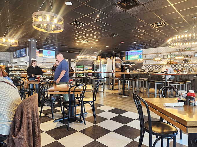 The classic black and white checkered floor isn't just nostalgic&mdash;it's a chessboard where every move leads to delicious victory. Modern lighting elevates the cozy diner vibe.