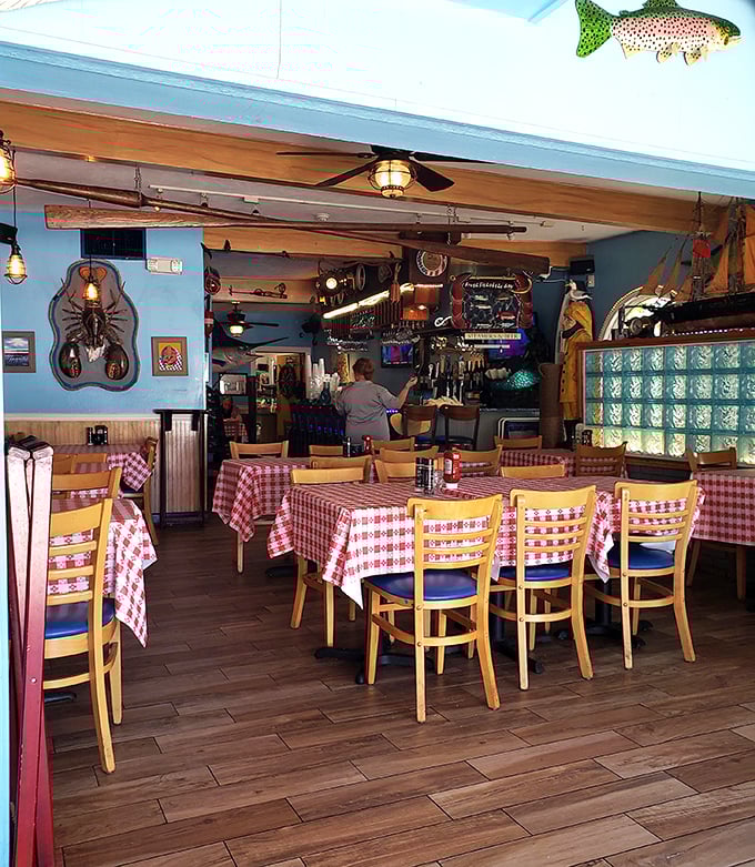 Classic red-checkered tablecloths and nautical decor create that perfect "I've discovered a hidden gem" feeling that makes seafood taste even better.