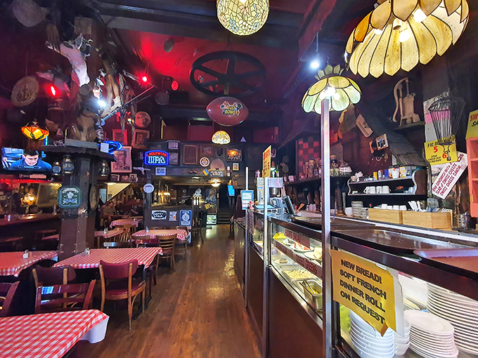 Step inside and time stops &ndash; flower-shaped lamps hang from a ceiling cluttered with memorabilia, while checkered tablecloths promise honest food ahead.