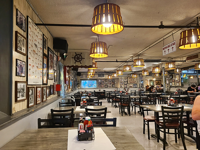 Wooden barrel lampshades cast a warm glow over decades of maritime memories. This isn't décor—it's a seafood shrine with stories in every corner.