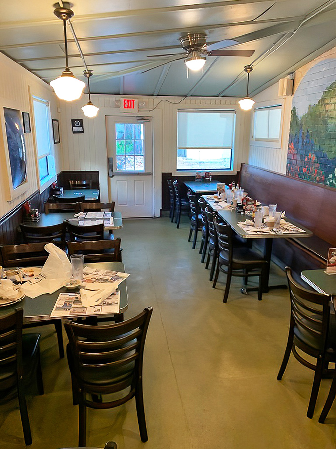 Classic diner charm with a Florida twist&mdash;pale blue ceiling, cozy booths, and newspapers waiting to be perused while debating between sweet or savory breakfast options.