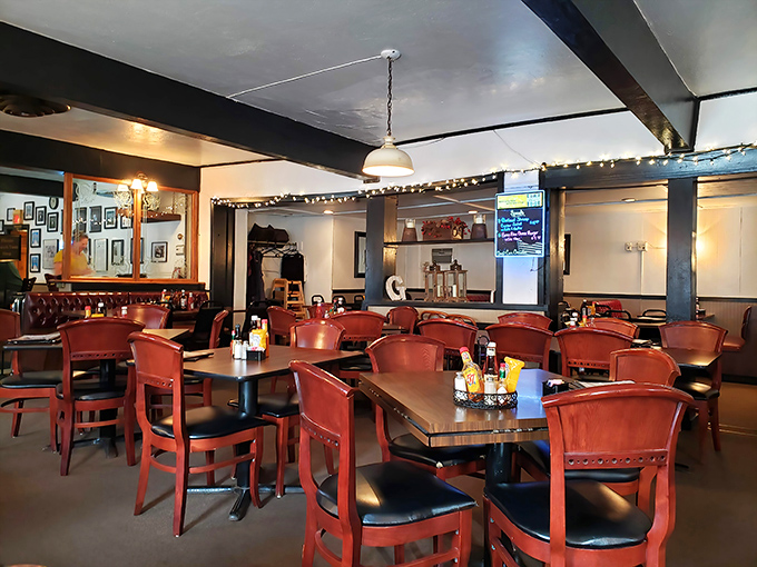 Red chairs, warm wood, and twinkling string lights create the perfect backdrop for serious steak contemplation. This isn't d&eacute;cor&mdash;it's dinner theater for carnivores.