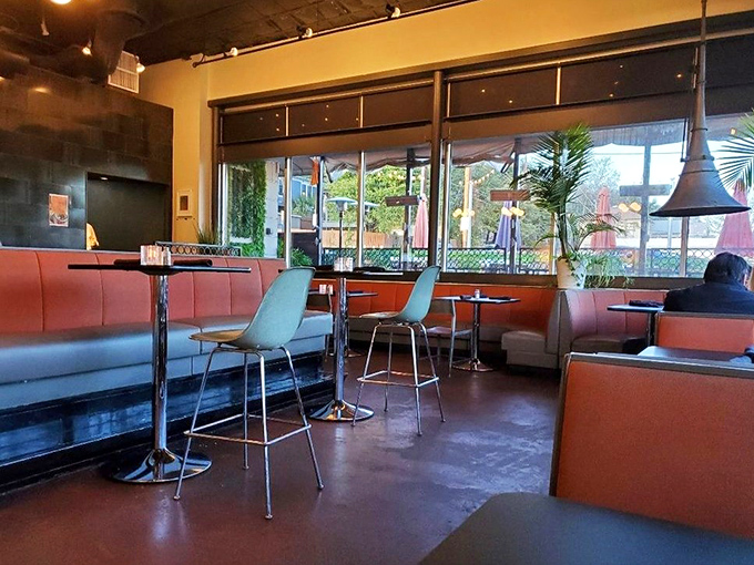 Mid-century modern meets Austin cool in this stylish interior where red booths invite you to slide in and stay awhile.
