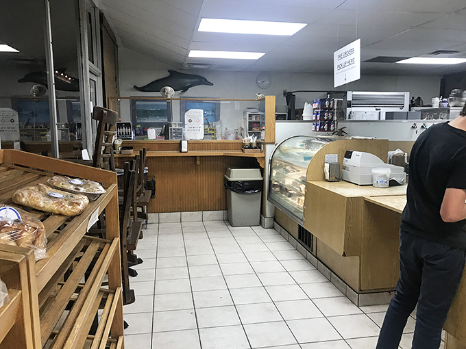 No-frills interior with maximum flavor payoff. The dolphin on the wall seems to know he's swimming in the right company.