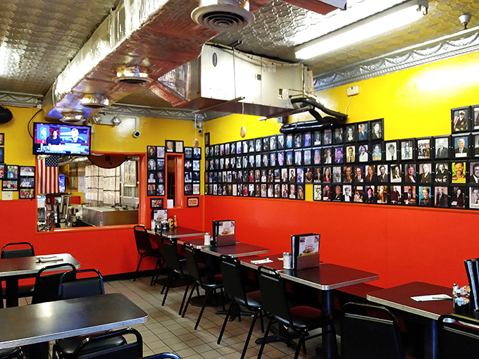 Orange walls and endless photos create a dining room that feels like America's family scrapbook come to life.