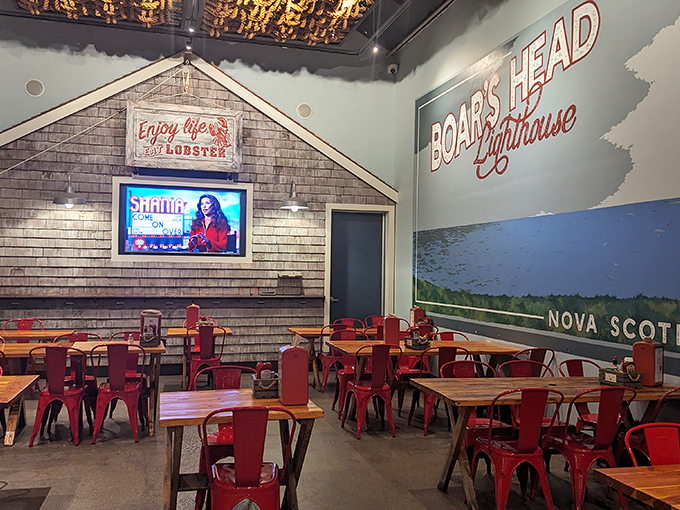 Inside, nautical New England comes alive with the "Boar's Head Lighthouse" mural and Nova Scotia imagery. Red metal chairs await seafood pilgrims seeking lobster salvation.
