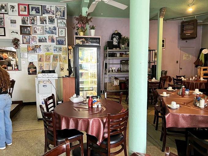 Inside, burgundy tablecloths and mint-green walls create a time capsule where conversations flow as freely as the coffee refills.