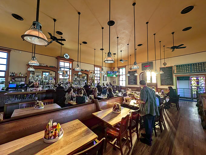 Church pews reimagined as dining tables? Brilliant! The soaring ceilings and pendant lights create a dining atmosphere that's both reverent and revelatory.