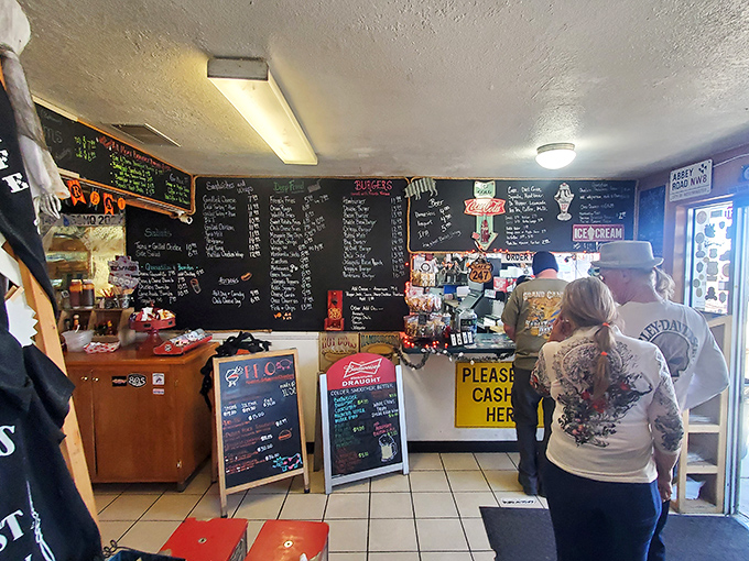 Inside, the massive chalkboard menu tells tales of culinary adventures to come, while customers eagerly await their desert oasis feast.