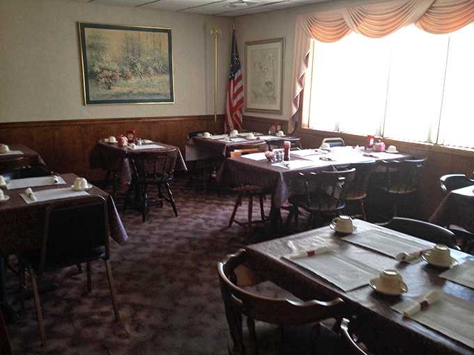 Step inside to a dining room where time slows down &ndash; wood paneling, tablecloths, and an American flag create that perfect small-town restaurant ambiance.