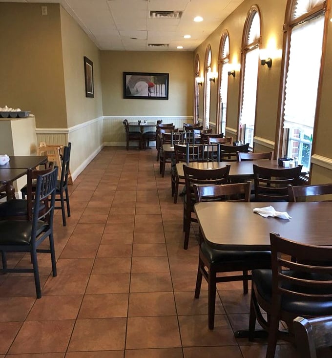Sunlight streams through arched windows, illuminating a dining room where conversations flow as freely as the coffee refills.