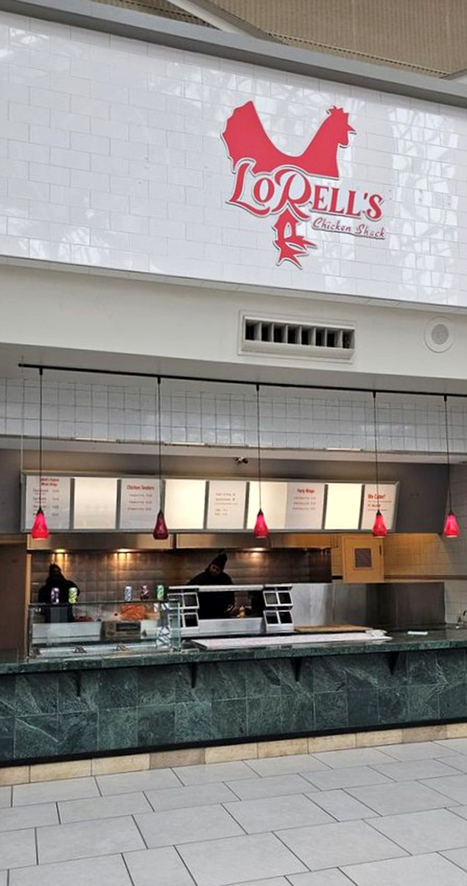 Behind that sleek green marble counter, culinary magic happens. The red pendant lights add a warm glow that says, "Good things are coming."