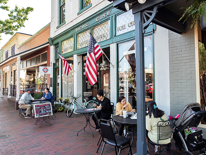 Sidewalk caf&eacute; culture thrives at Picnic Caf&eacute;, where American flags flutter above outdoor tables and conversations flow as freely as the coffee.