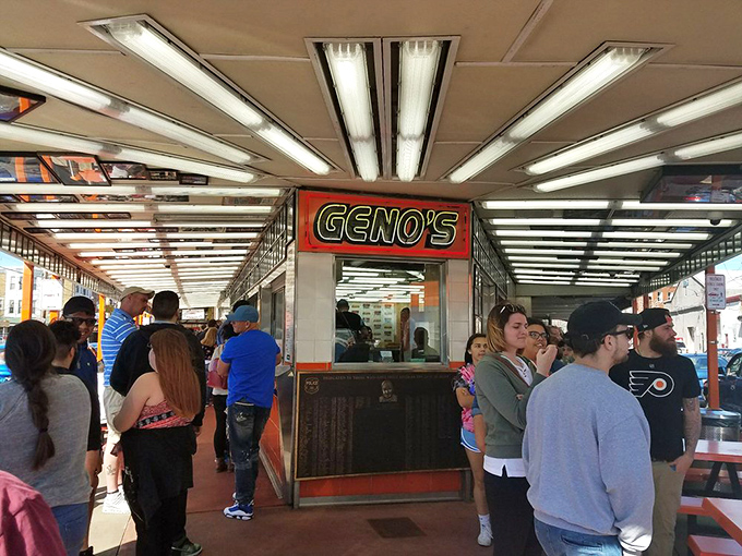 Democracy in action at the ordering window, where CEOs and construction workers stand shoulder-to-shoulder in pursuit of sandwich perfection.