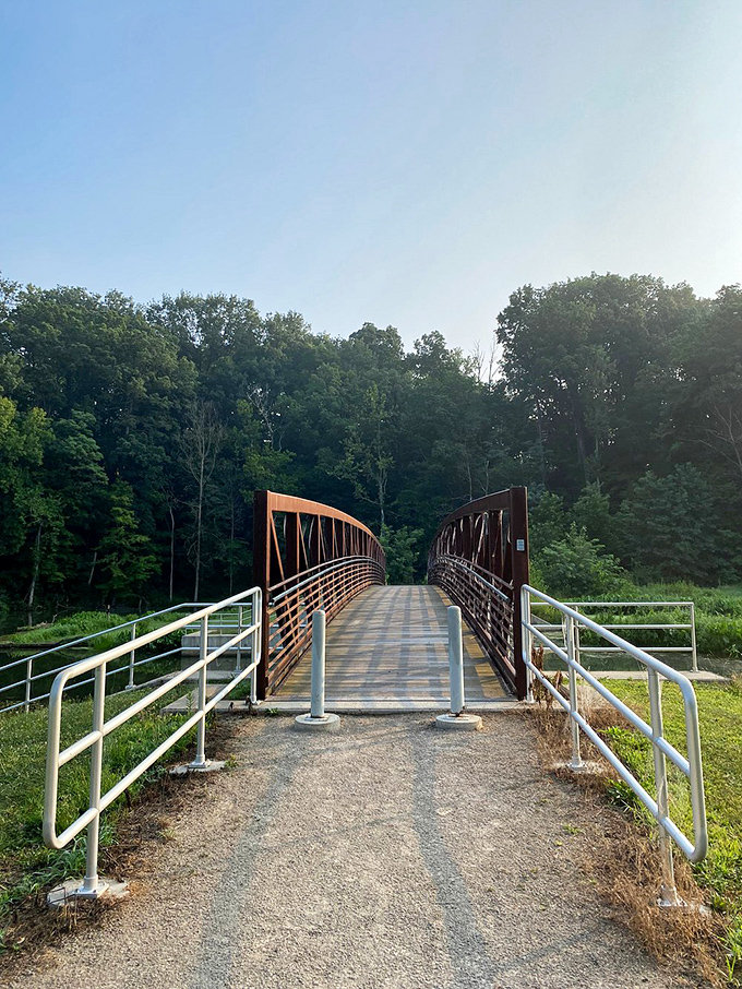 Nature's red carpet treatment - this pedestrian bridge knows how to make an entrance.
