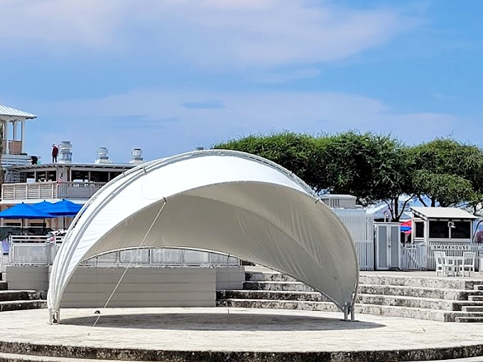 The elegant white canopy of Seaside's amphitheater provides shade for everything from impromptu guitar strumming to organized concerts, all with the Gulf breeze as nature's air conditioning.