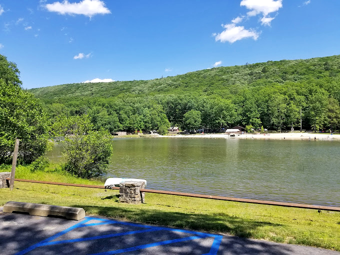 The rolling hills create nature's amphitheater around the lake, where the only drama is deciding where to spread your picnic blanket.
