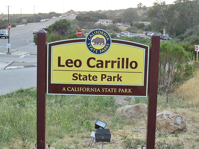 The entrance sign promises adventure, but doesn't mention the side effects: spontaneous smiling and the sudden urge to cancel all your meetings. 