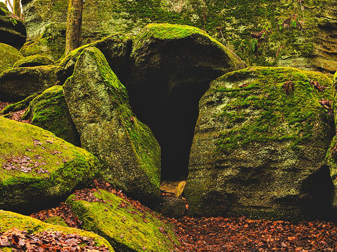 Mother Nature's sculpture garden at work. This moss-covered portal between massive sandstone blocks looks like Tolkien's imagination come to life.