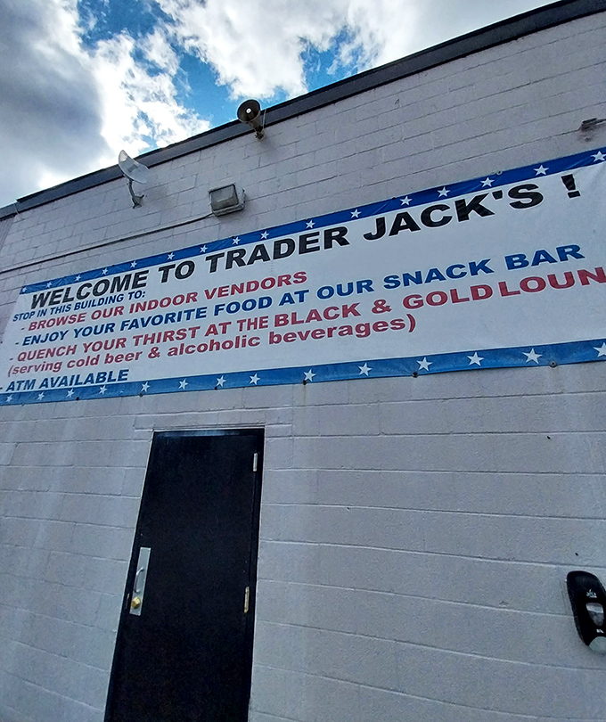 The gateway to bargain paradise! This unassuming entrance leads to a labyrinth of vendors where one person's castoffs become another's prized possessions.