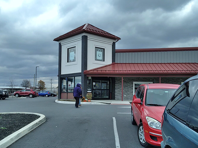 Even on cloudy days, the distinctive red-roofed tower stands as a beacon for thrift enthusiasts. Like a lighthouse guiding ships to shore, it guides shoppers to deals.