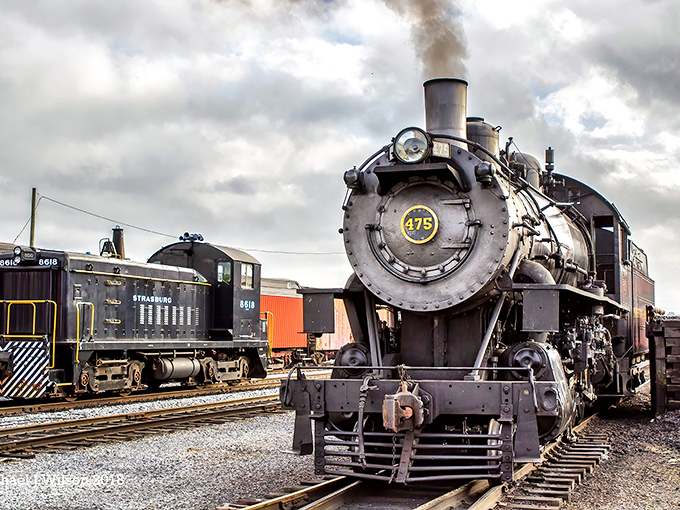 Engine 475 stands proud, its polished brass gleaming against the moody sky &ndash; a mechanical masterpiece that's seen more of America than most of us ever will.