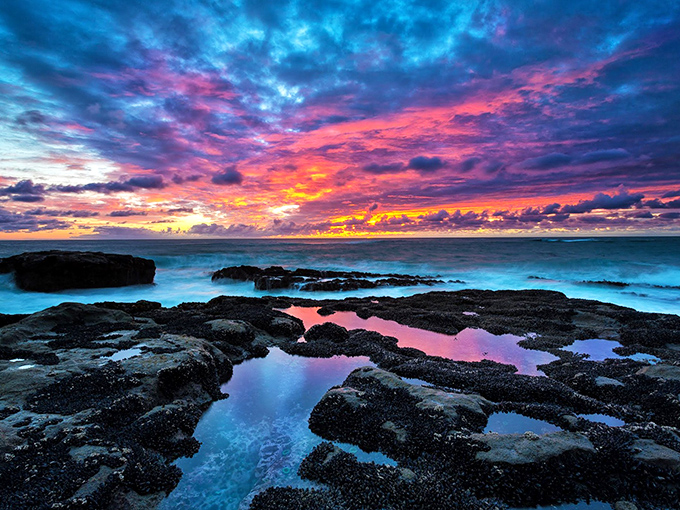 Mother Nature showing off her painting skills at sunset. If Bob Ross were here, he'd add a few "happy little clouds" and call it perfect.