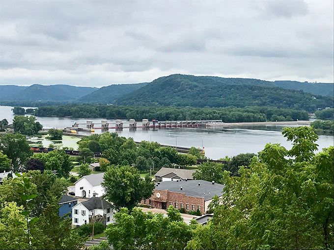 Where the Mississippi meets the bluffs. This panoramic view showcases Trempealeau's lock and dam system, nature's drama unfolding on a grand stage.