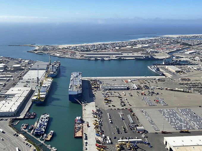 The deep-water port isn't just functional&mdash;it's fascinating. Container ships and naval vessels create a maritime ballet that's surprisingly mesmerizing from this bird's-eye perspective.