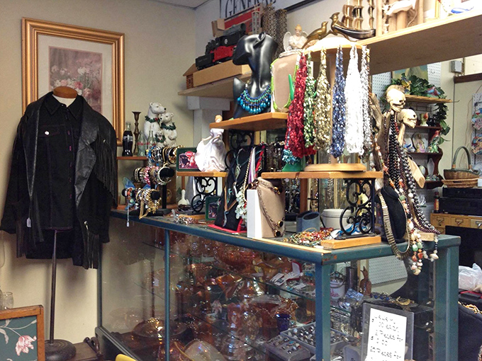 A jewelry lover's dream corner where vintage necklaces cascade like colorful waterfalls, each strand telling stories of bygone cocktail parties and special occasions.