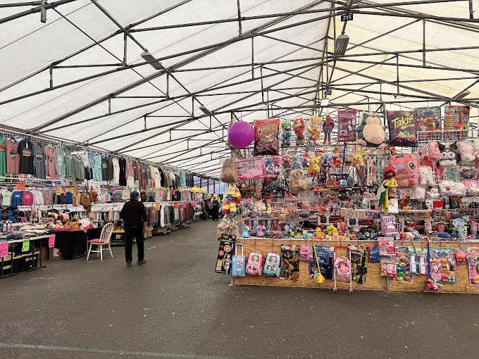 Retail therapy takes on new meaning when you're navigating aisles where fashion finds hang like colorful stalactites in this shopper's cave of wonders.
