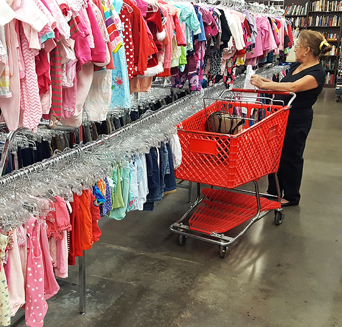 Rainbow racks of children's clothing await new homes, where tiny fashionistas can build wardrobes without parents breaking the bank.