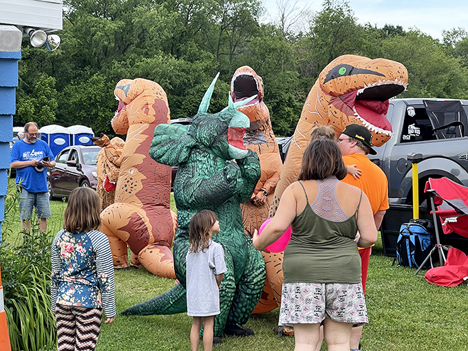Movie magic comes alive between showings as inflatable dinosaurs roam the grounds, delighting children and bringing prehistoric charm to intermission.