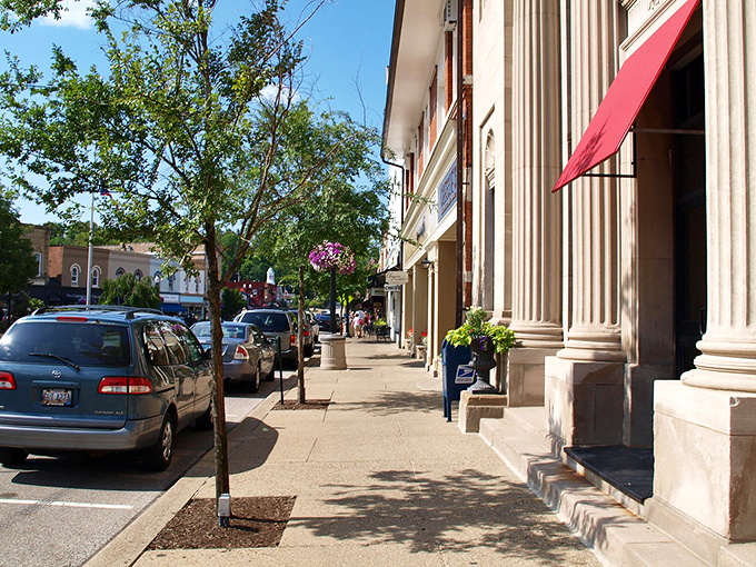 Main Street's elegant columns and red awnings create that perfect small-town tableau&mdash;Norman Rockwell would've needed extra canvas just to capture all this charm. 